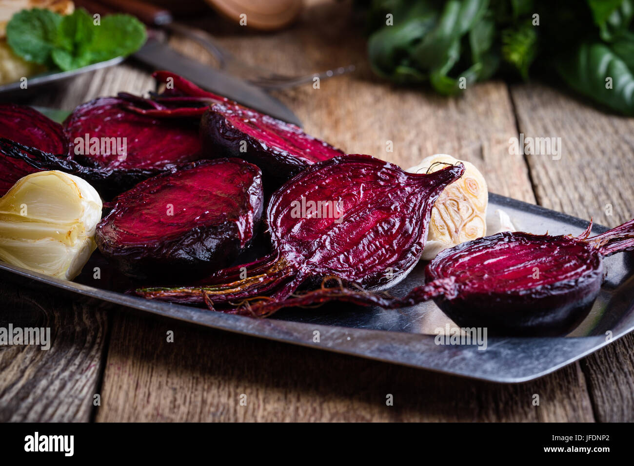 Sliced baked beetroot on rustic outdoor party table, diet and healthy ...