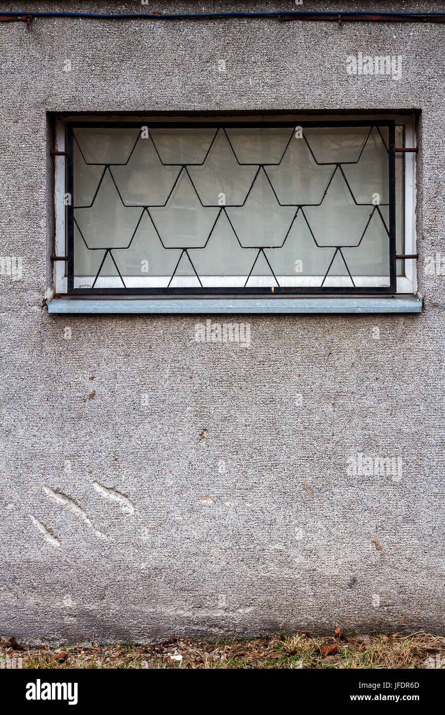 Concrete wall with a window and ground. Architecture background Stock ...