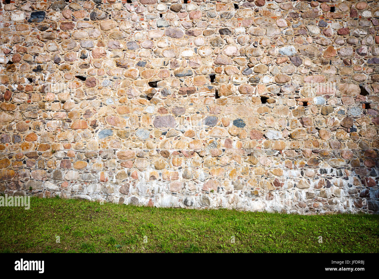 Wall of mixed materials - stone and bricks - old castle wall Stock ...