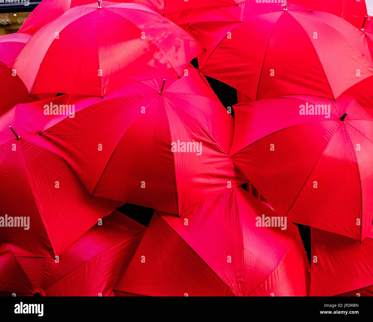 Red umbrellas hi-res stock photography and images - Alamy