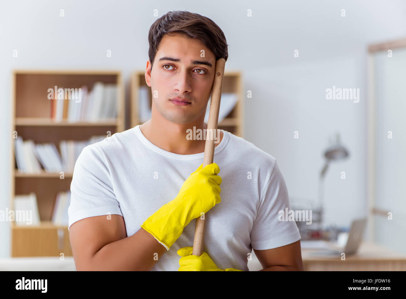 Man husband cleaning the house helping wife Stock Photo - Alamy