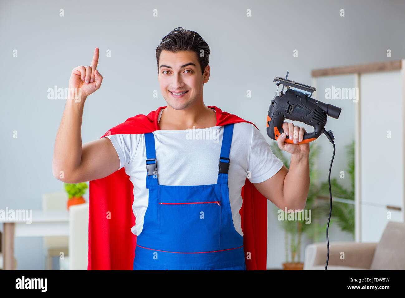 Super hero repairman working at home Stock Photo - Alamy