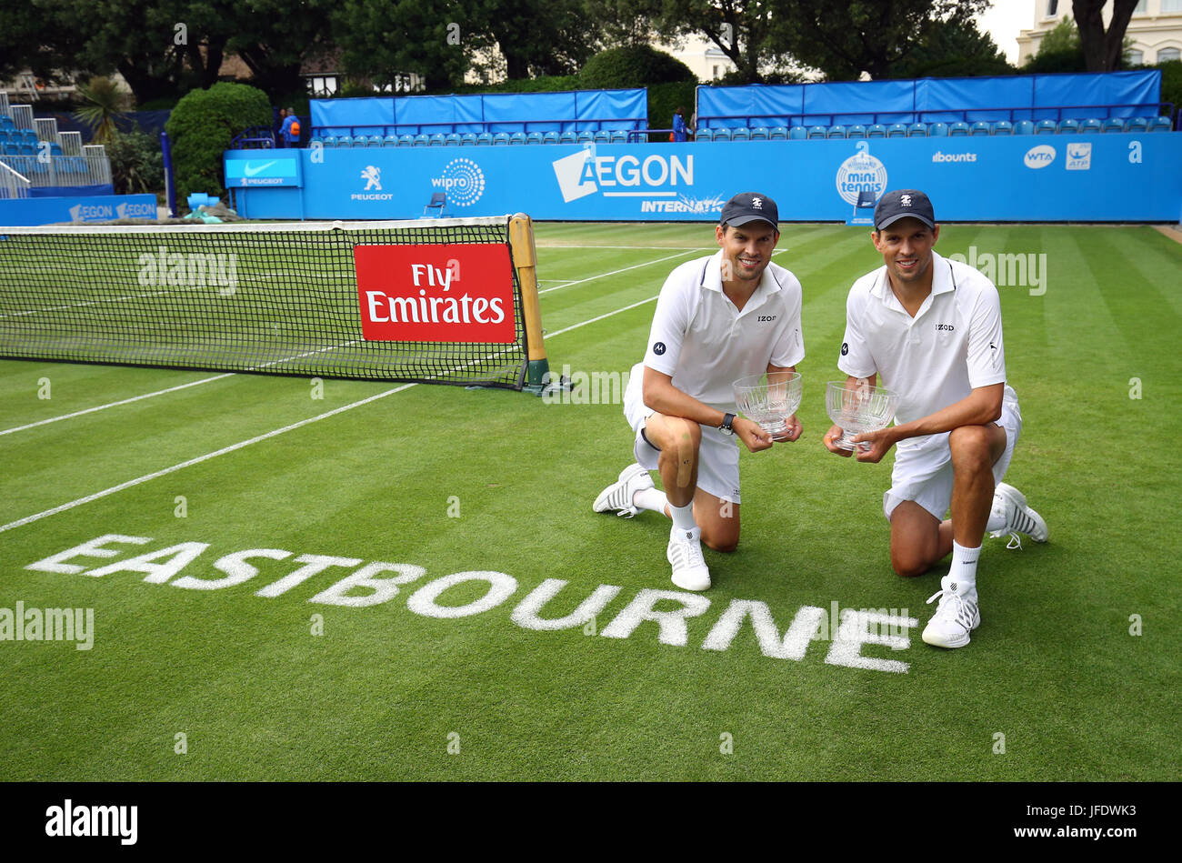 USA's Bob (left) and Mike Bryan celebrate with their trophies after ...