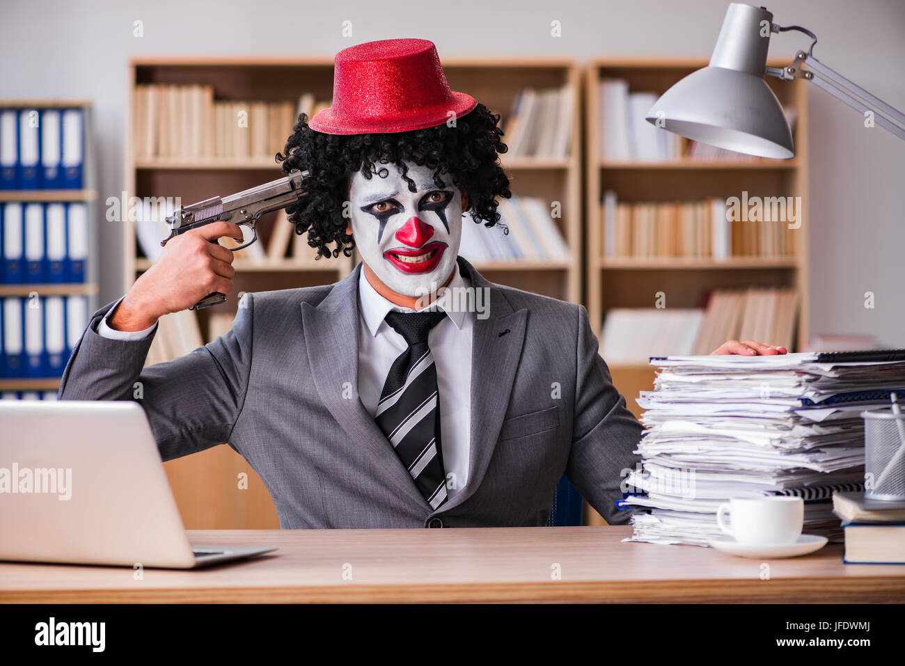 Clown businessman working in the office Stock Photo - Alamy