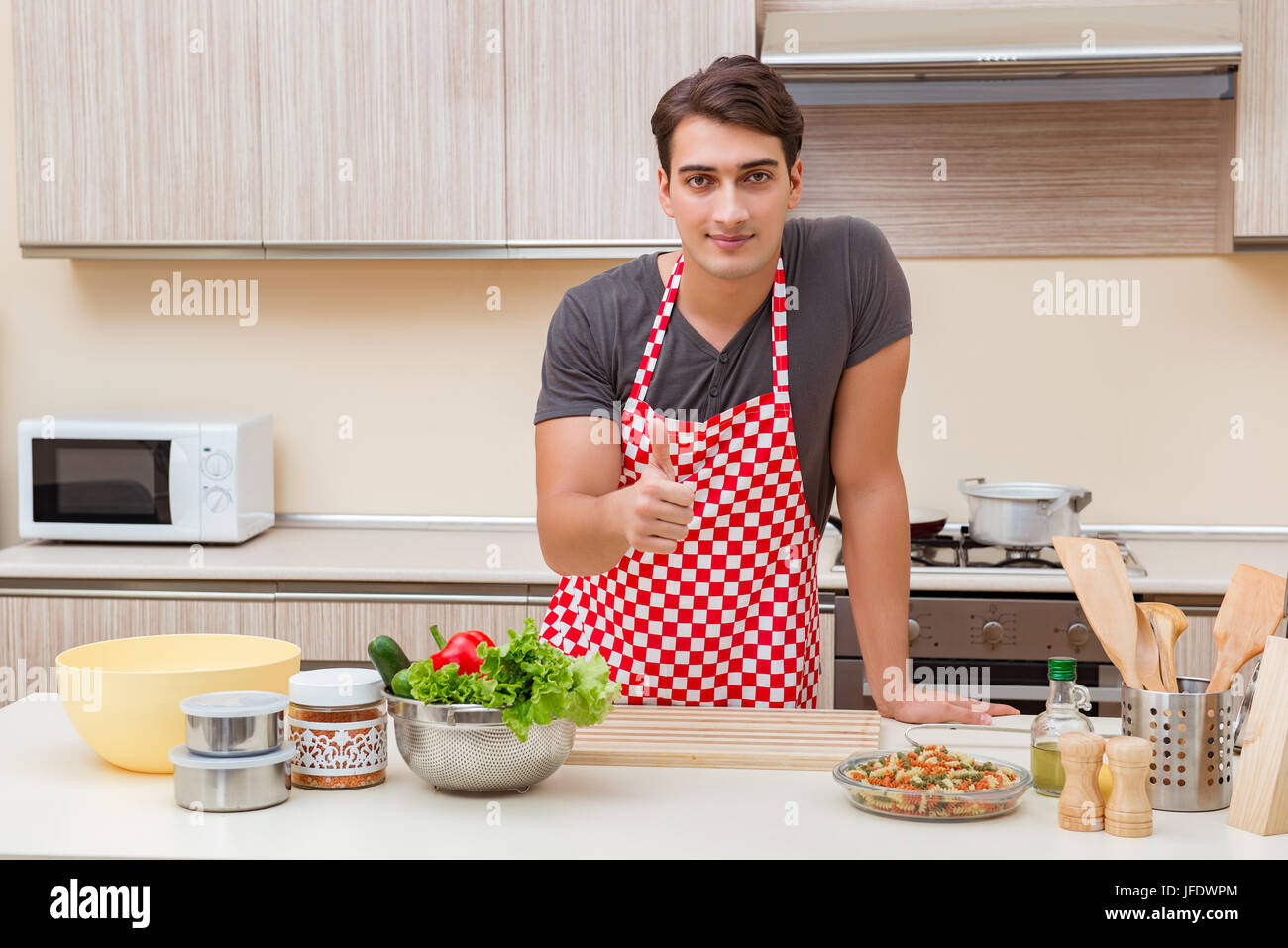 Man male cook preparing food in kitchen Stock Photo - Alamy