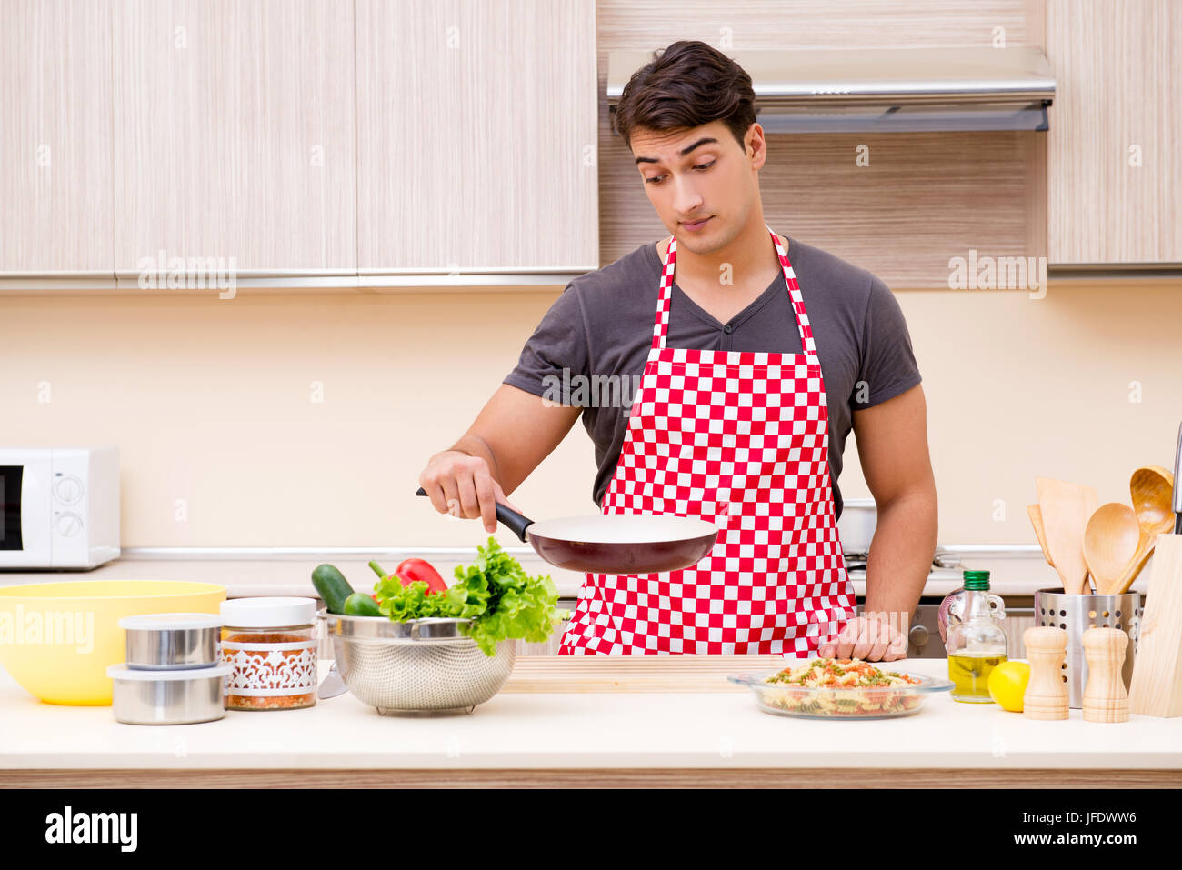 Man male cook preparing food in kitchen Stock Photo - Alamy