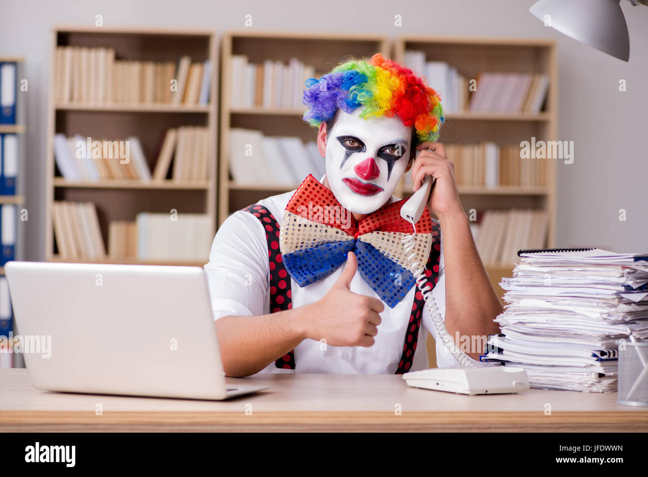 Clown businessman working in the office Stock Photo - Alamy