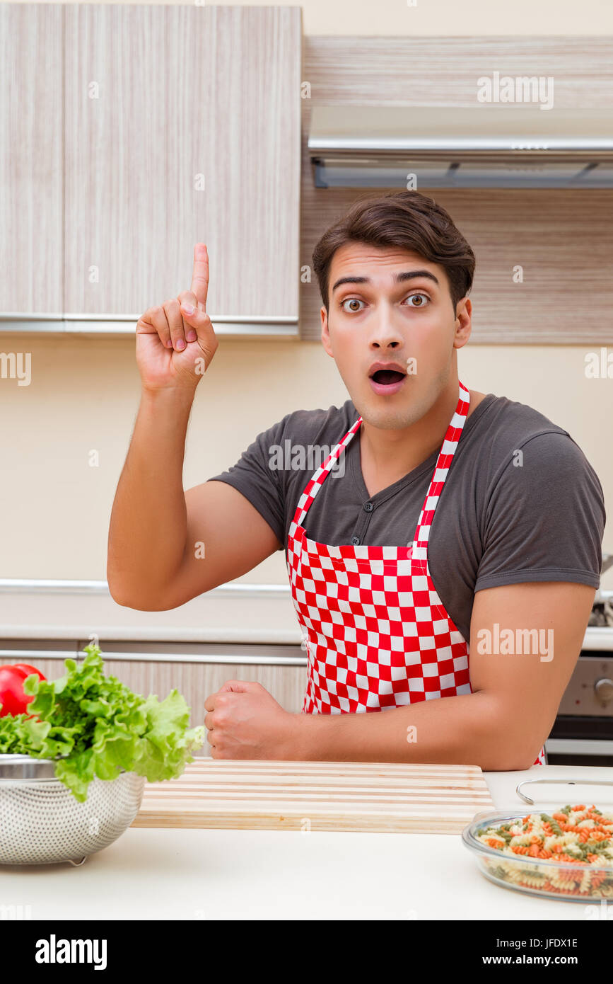 Man male cook preparing food in kitchen Stock Photo - Alamy