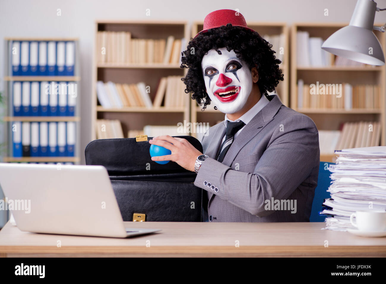 Clown businessman working in the office Stock Photo - Alamy