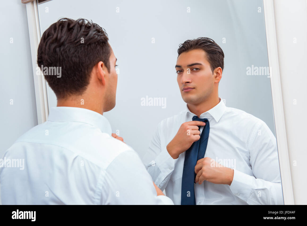 Businessman dressing up for work Stock Photo - Alamy