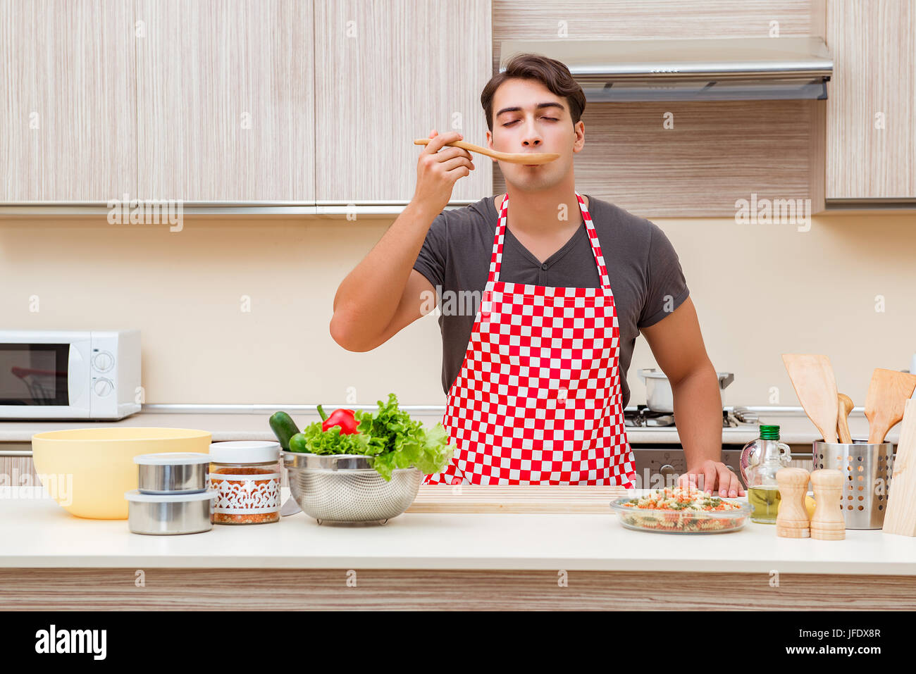 Man male cook preparing food in kitchen Stock Photo - Alamy