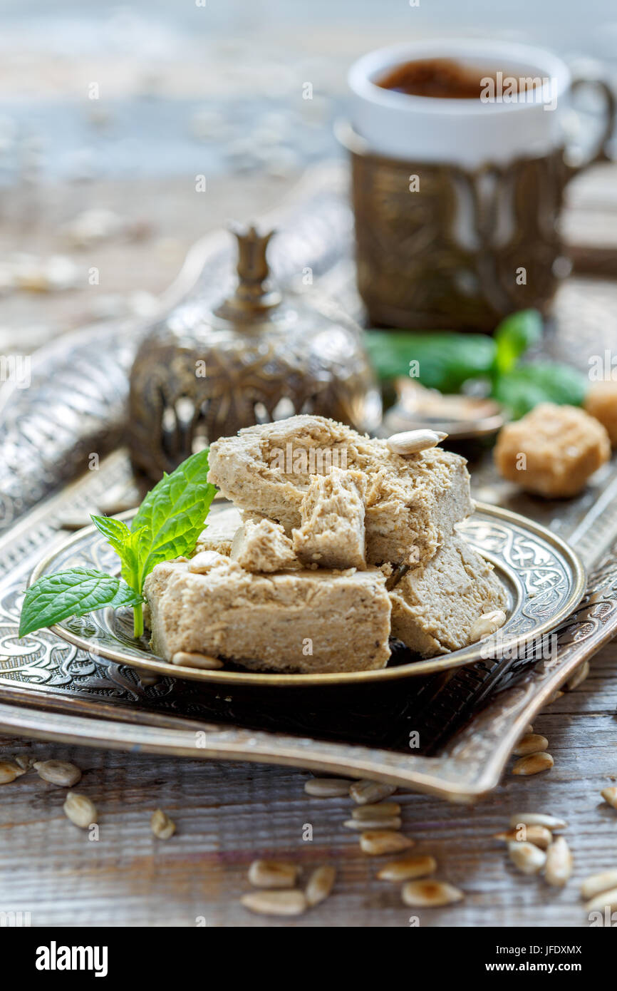 Halva of sunflower seeds and mint on a bronze plate Stock Photo - Alamy