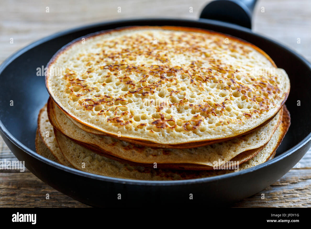 Pancake in a frying pan close up Stock Photo - Alamy