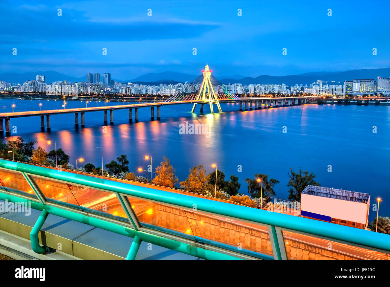 The Olympic bridge on Han river against Seoul Skyline at the blue hour ...