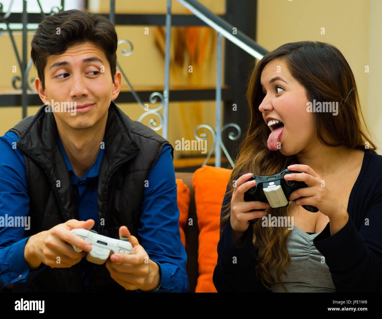 Handsome smiling young man playing video games with a victory expresion ...