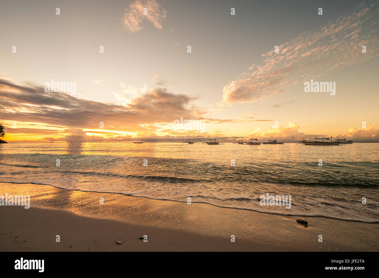 Tropical beach sunset at Philippines Stock Photo - Alamy