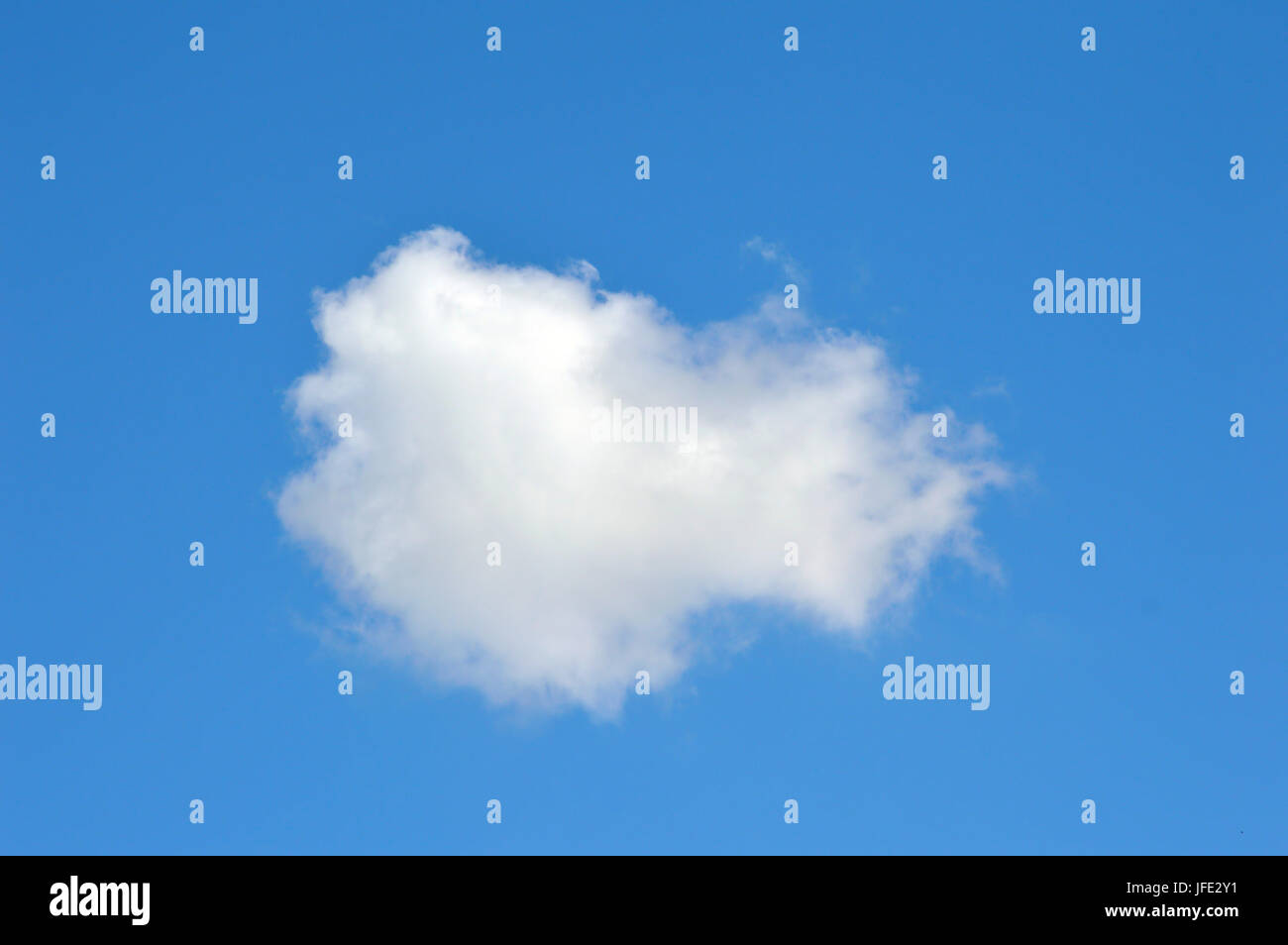One cloud in a clear blue sky Stock Photo - Alamy