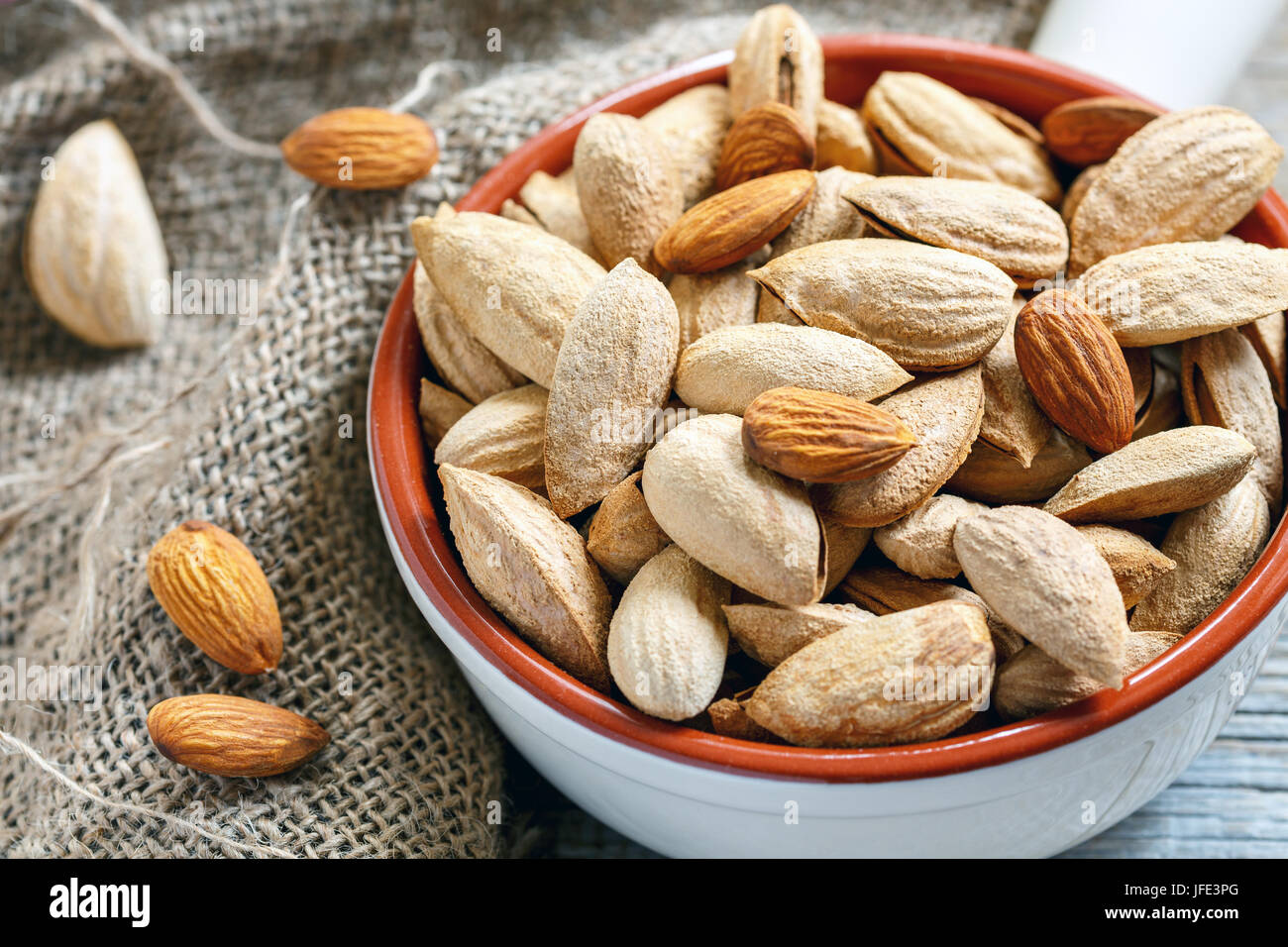 Ceramic bowl with almond closeup Stock Photo - Alamy