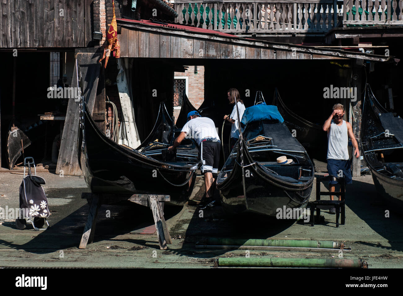 Venice - June, 2017. Craftsmen repair a gondola at San Trovaso in ...
