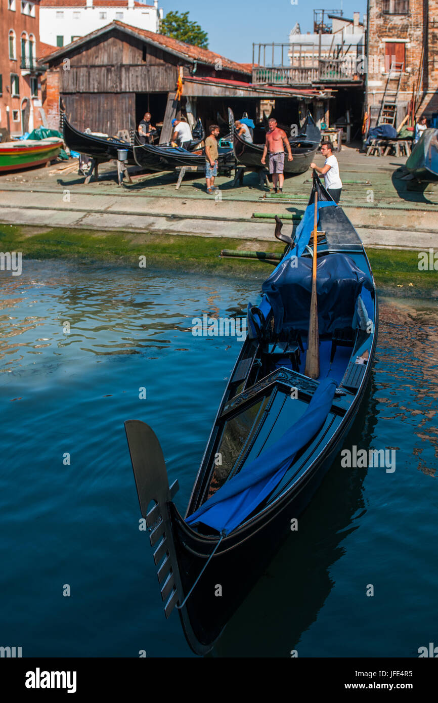 Venice - June, 2017. Craftsmen repair a gondola at San Trovaso in ...