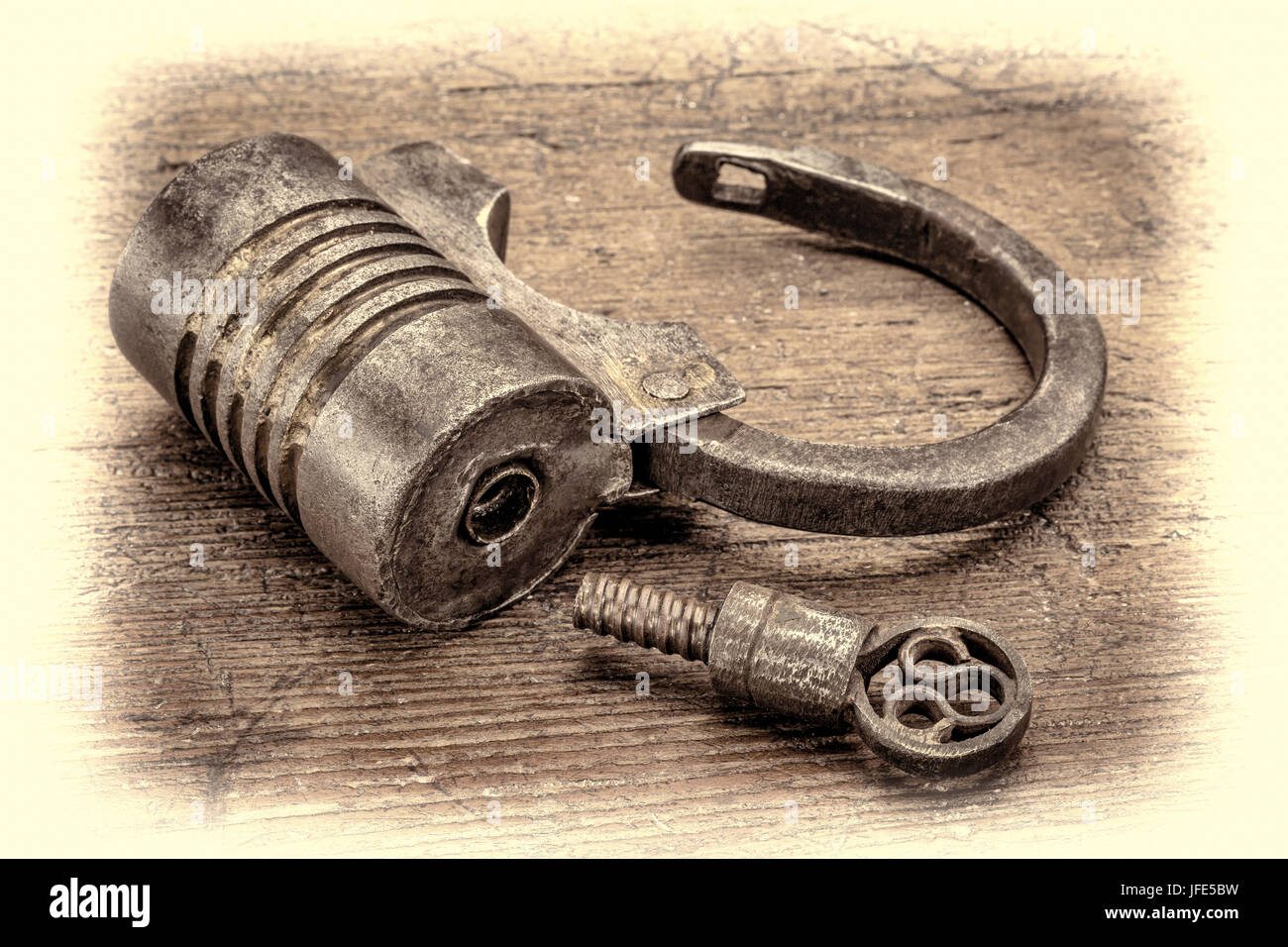 Vintage round shape hand crafted screw type iron padlock (unlocked ...