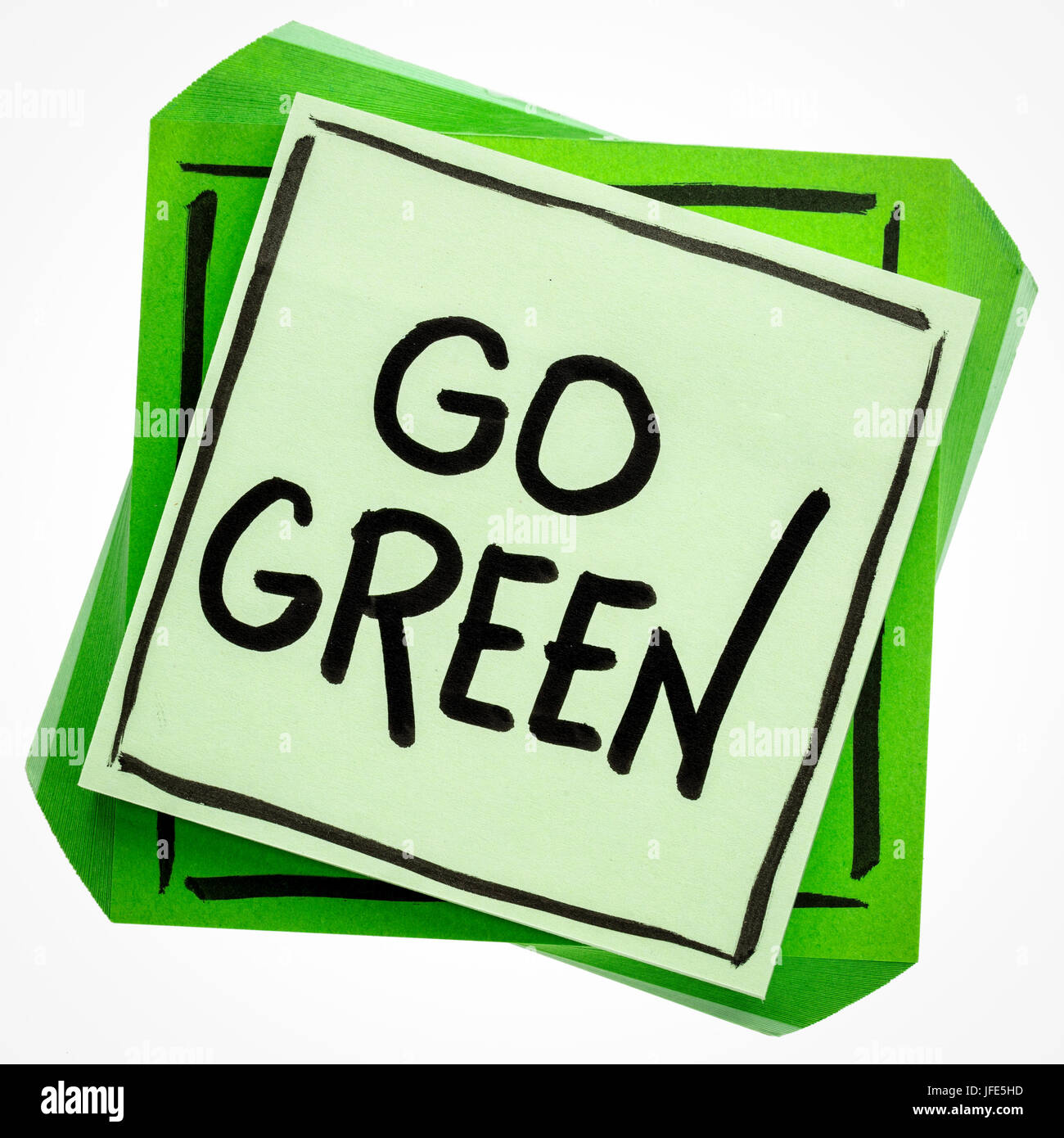 go green reminder - handwriting on an isolated sticky note Stock Photo ...