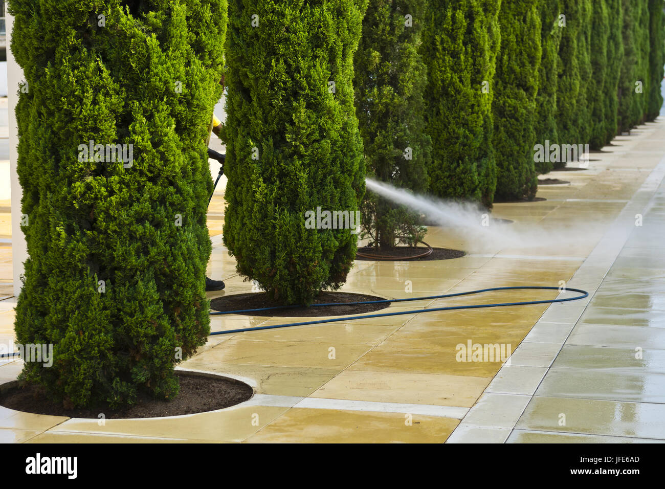 Cleaning the Streets with Water Stock Photo - Alamy