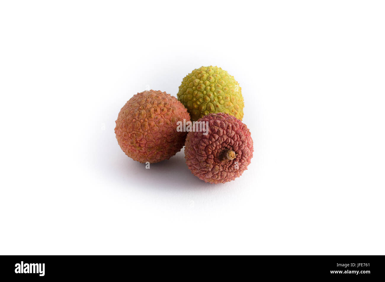 three lychee fruits isolated on white background Stock Photo - Alamy