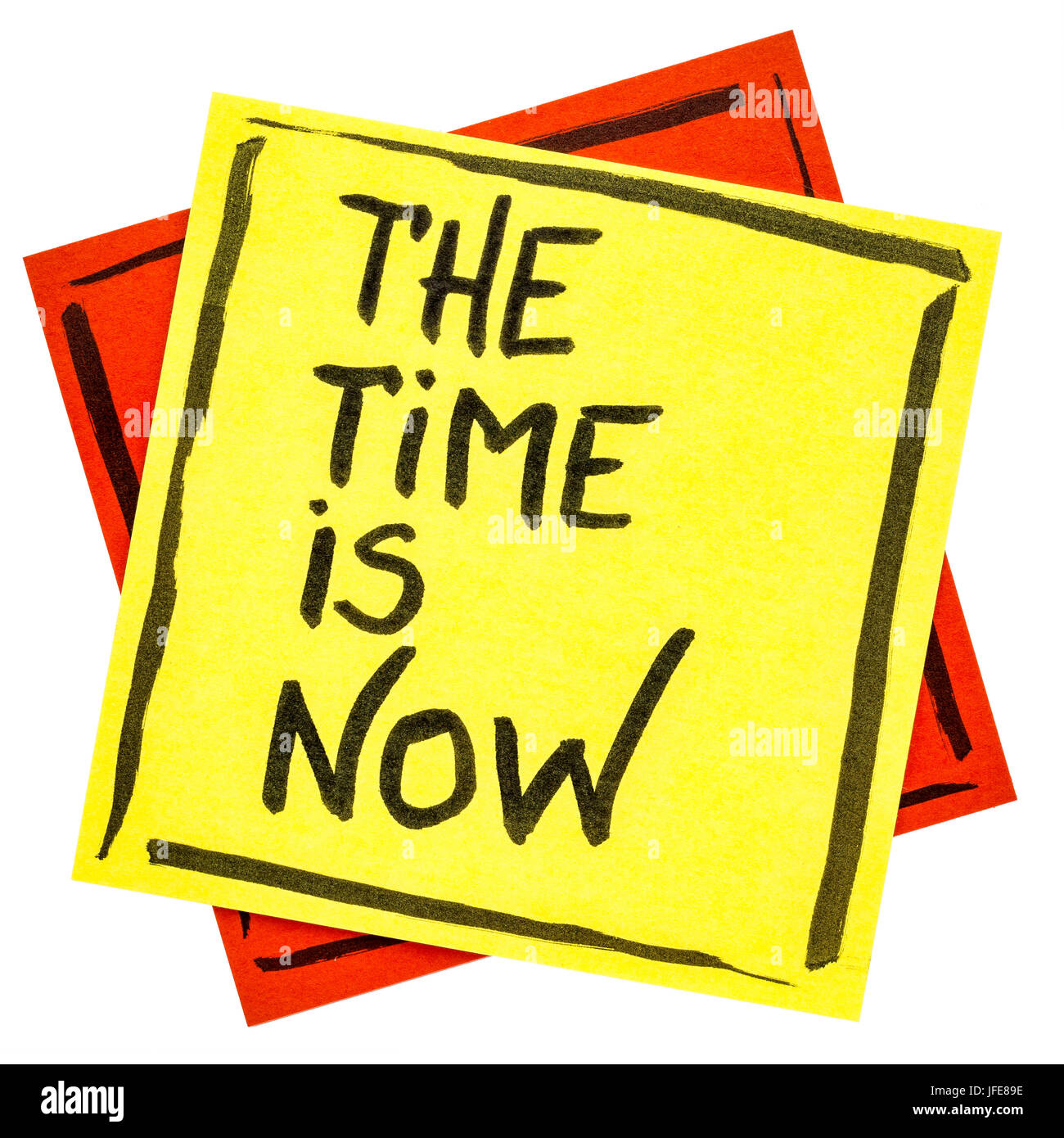 The time is now reminder - handwriting on an isolated sticky note Stock ...