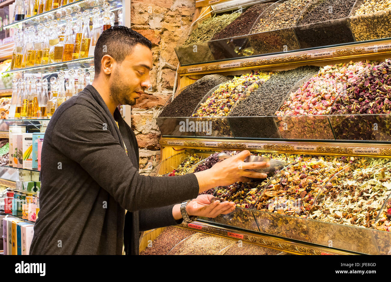 ISTANBUL, TURKEY - 7 APRIL , 2017: Sellers of spices and sweets in the ...
