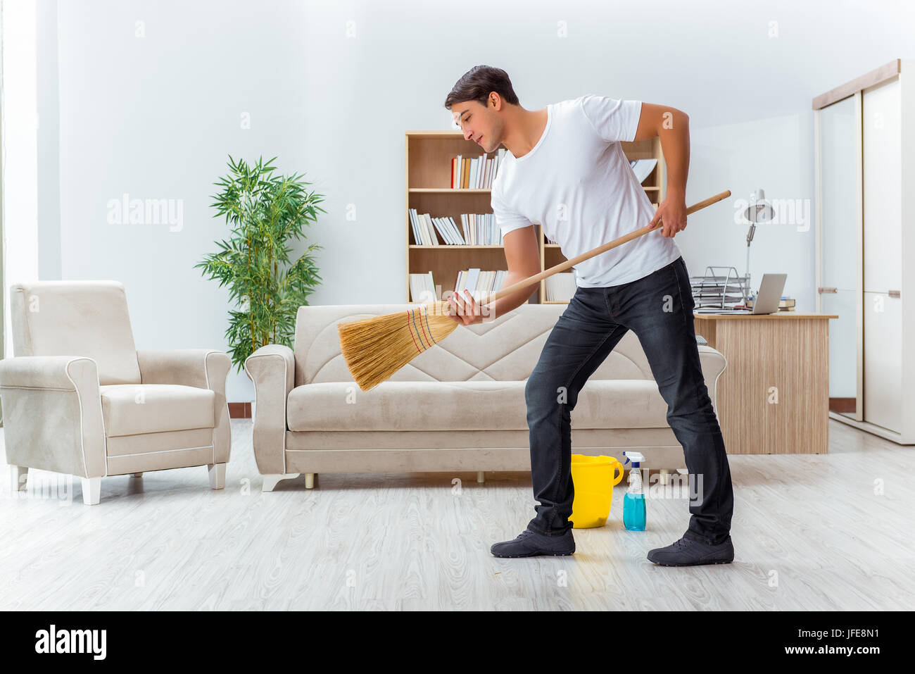 Man husband cleaning the house helping wife Stock Photo - Alamy