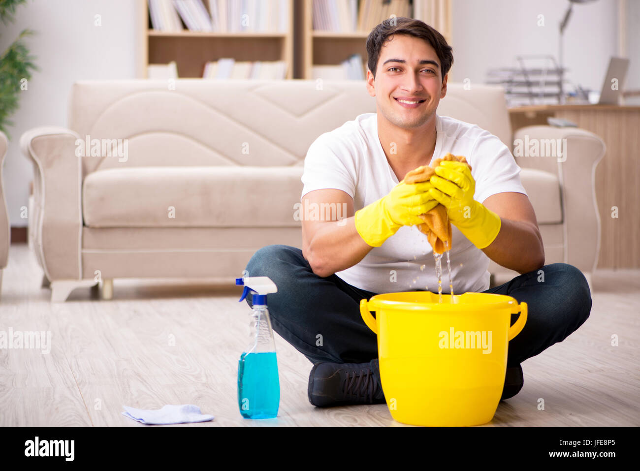 Man husband cleaning the house helping wife Stock Photo - Alamy