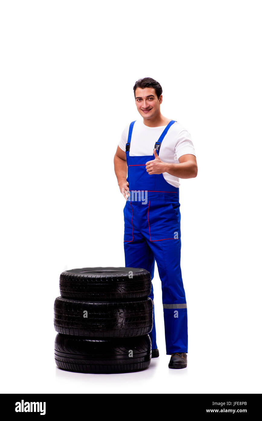 Handsome tyre repairman isolated on white Stock Photo - Alamy