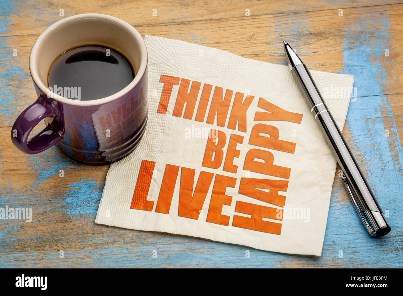 think, be, live happy - word abstract on a napkin with a cup of ...