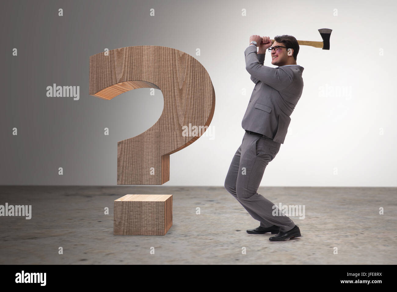 Angry man with axe axing the question mark Stock Photo - Alamy