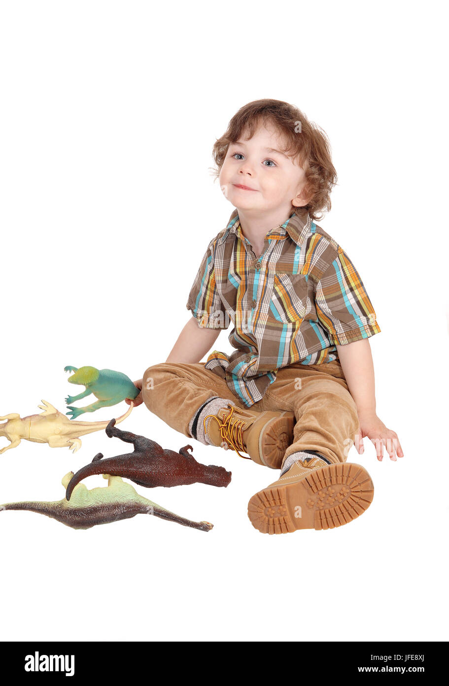 Smiling little boy with his toys Stock Photo - Alamy