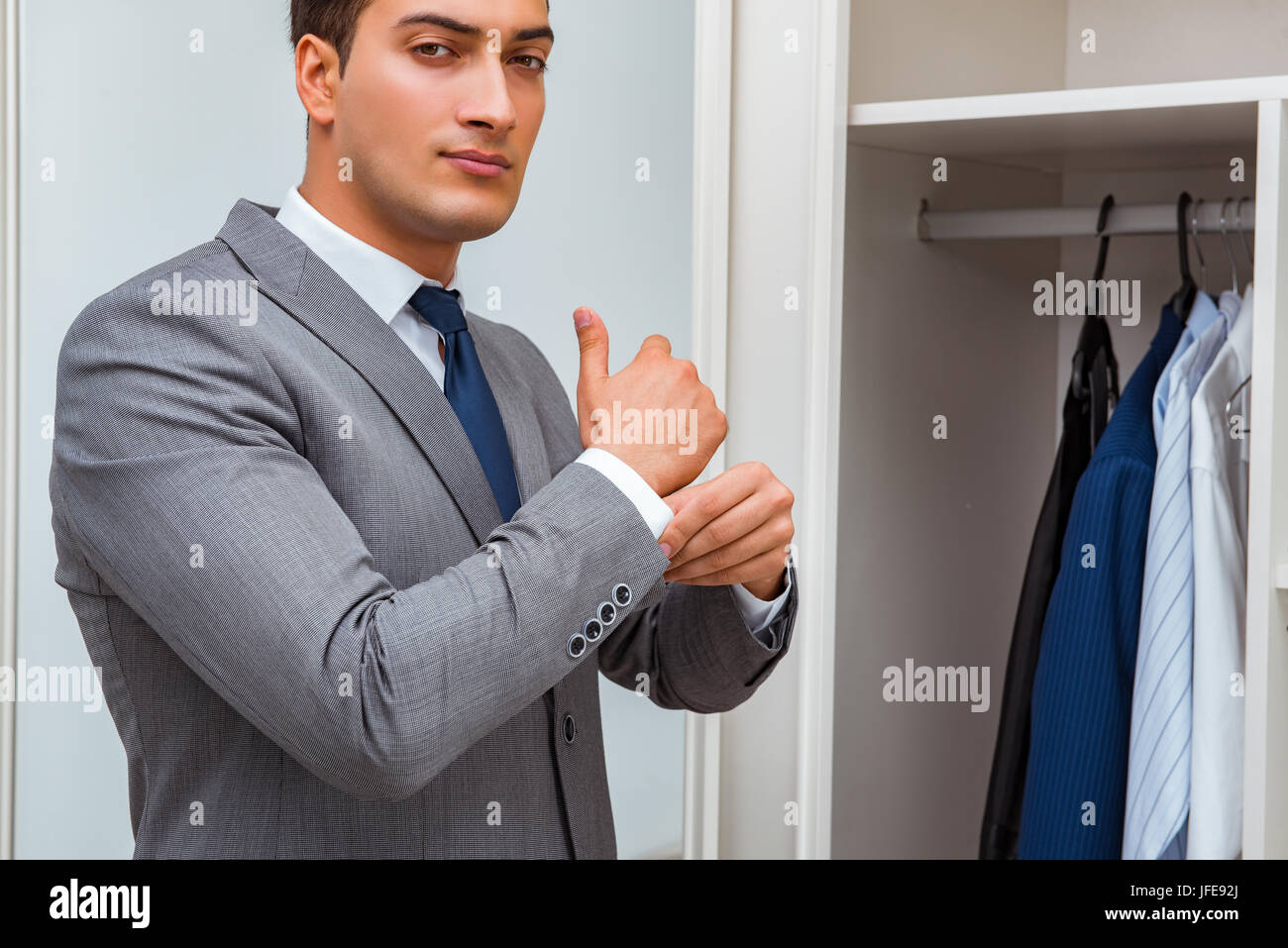 Businessman dressing up for work Stock Photo - Alamy