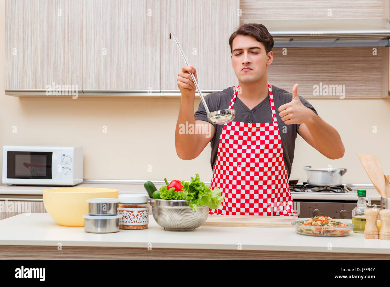 Man male cook preparing food in kitchen Stock Photo - Alamy