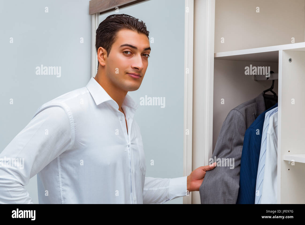 Businessman dressing up for work Stock Photo - Alamy