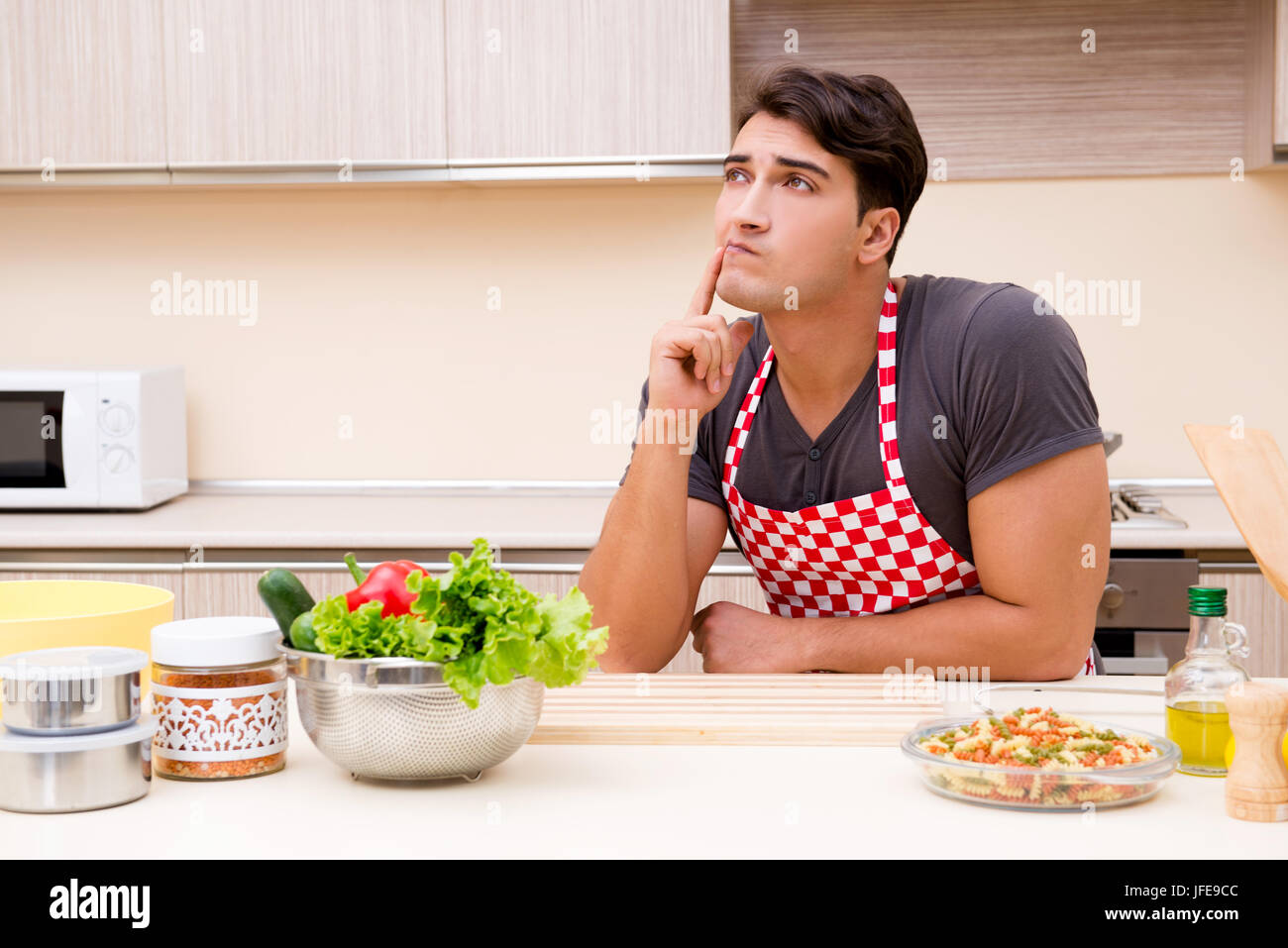 Man male cook preparing food in kitchen Stock Photo - Alamy