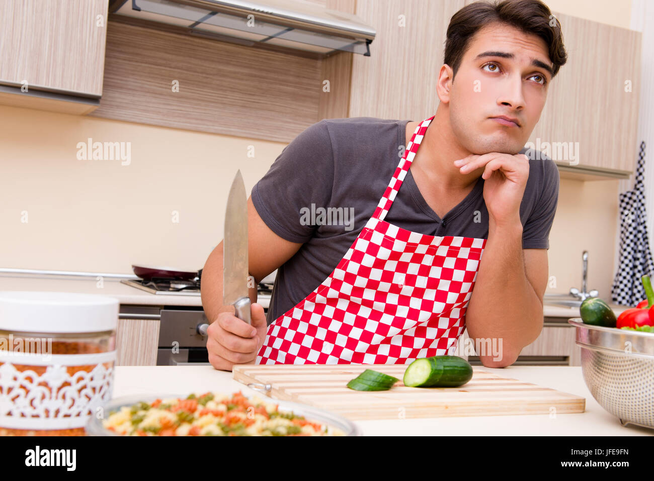 Man male cook preparing food in kitchen Stock Photo - Alamy