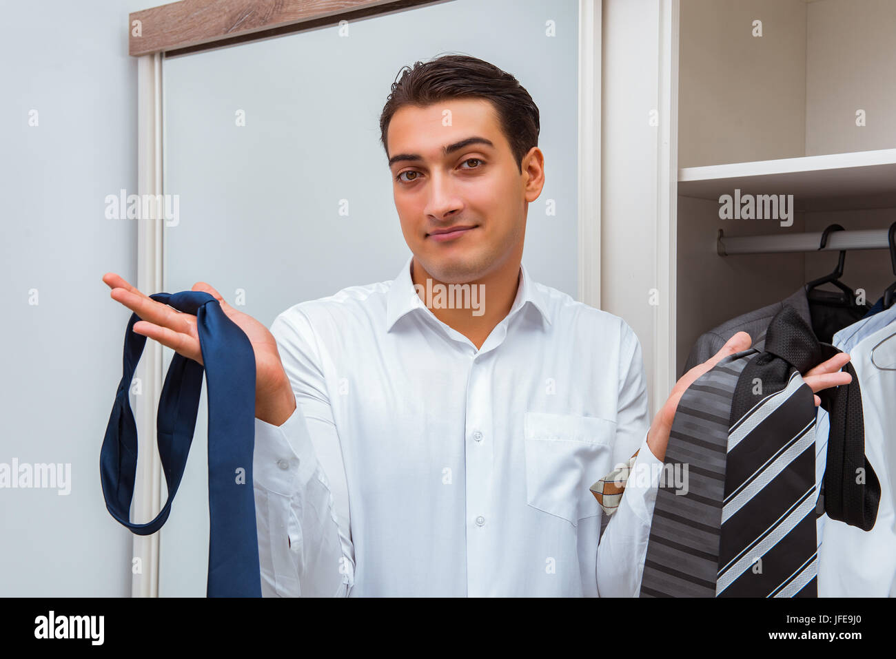 Businessman dressing up for work Stock Photo - Alamy