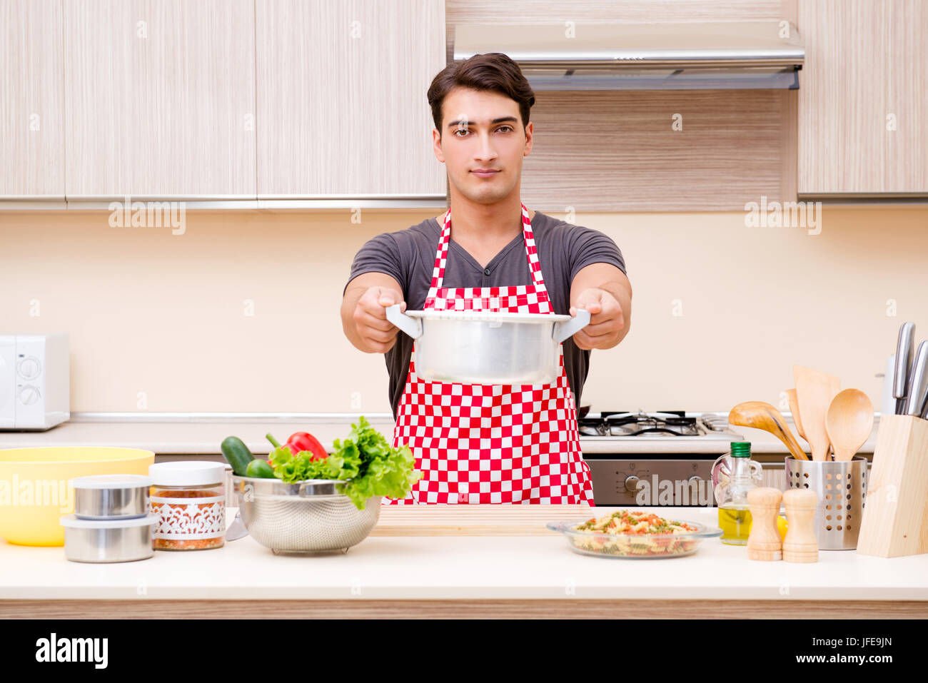 Man male cook preparing food in kitchen Stock Photo - Alamy