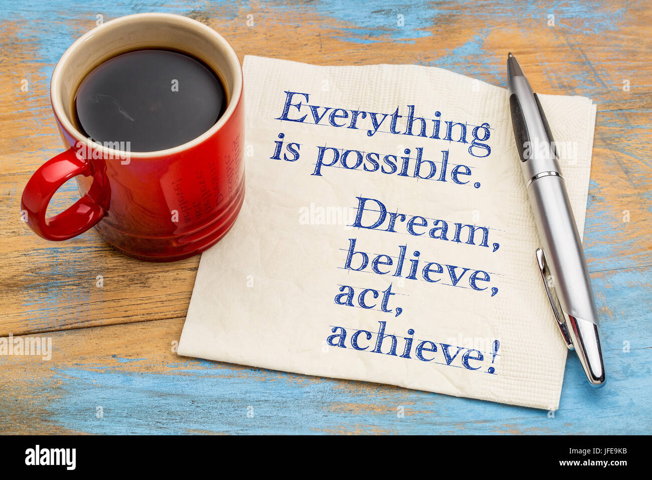 Everything is possible. Dream, believe, act, achieve! A handwriting on ...