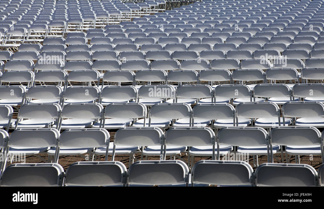 Lots of white chairs at the stadium Stock Photo - Alamy