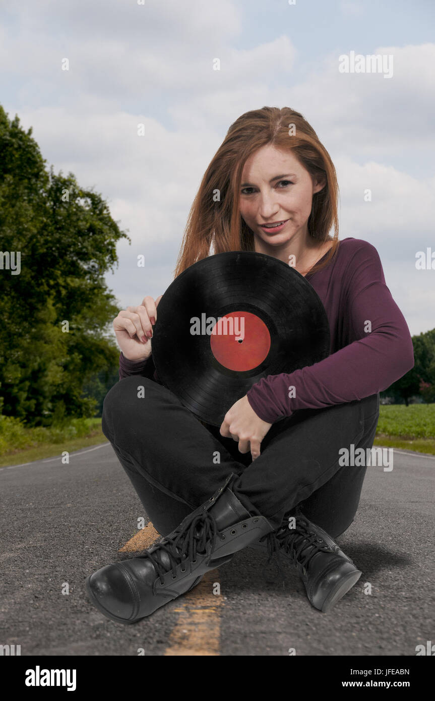 Woman with vinyl record Stock Photo - Alamy
