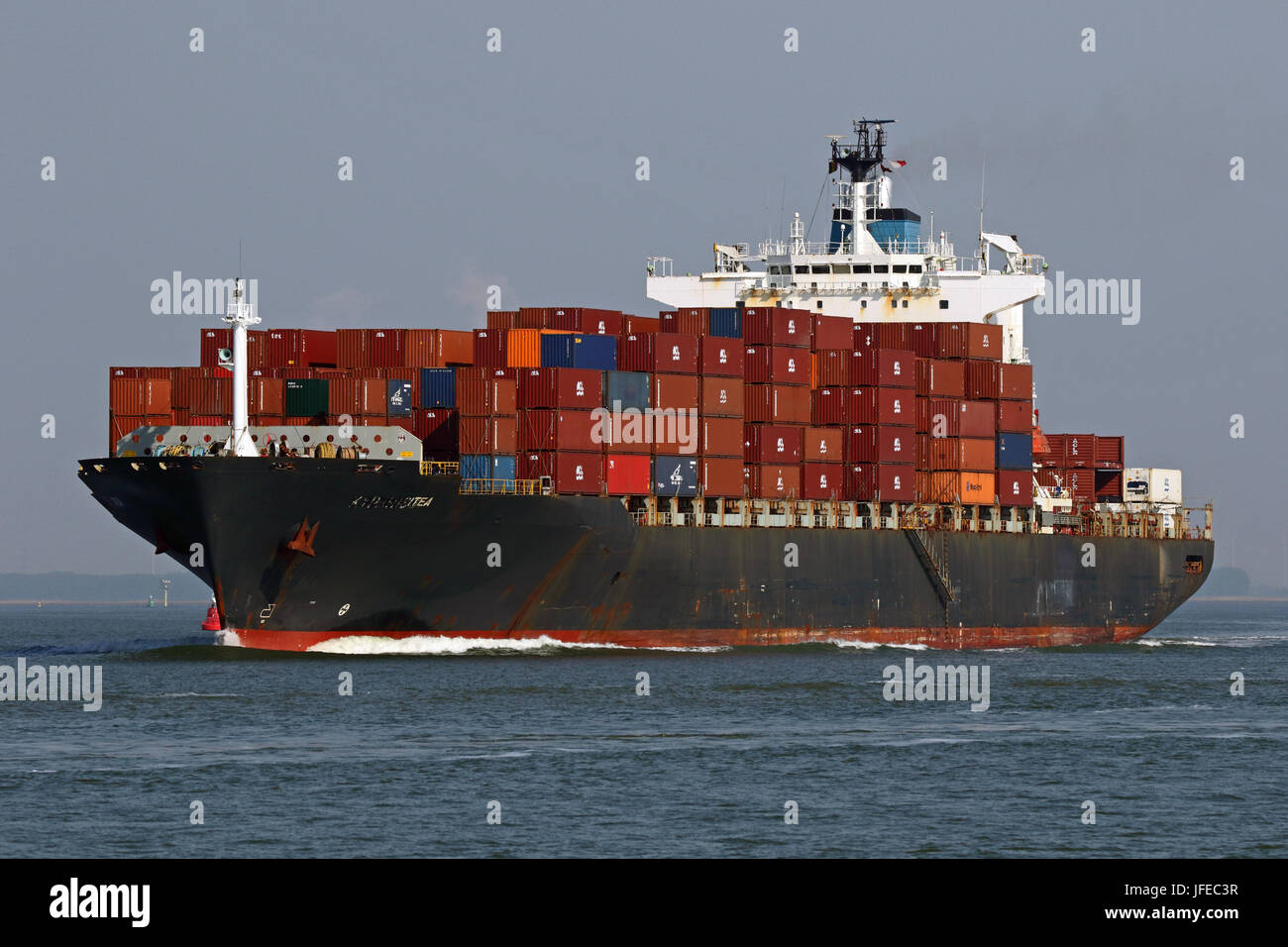 The container ship Itea leaves the port of Antwerp and passes ...