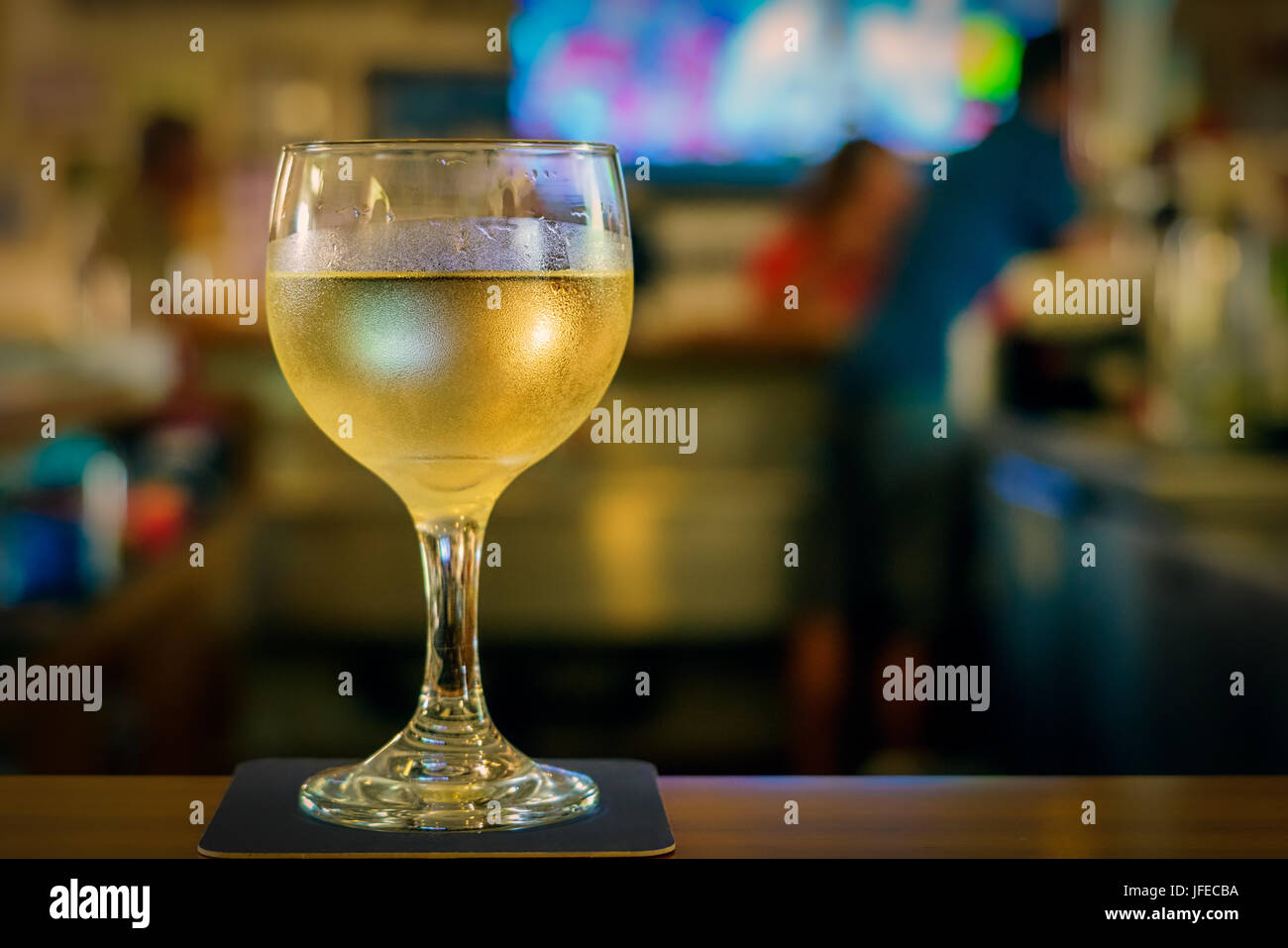 A glass of white wine ready for sampling Stock Photo - Alamy