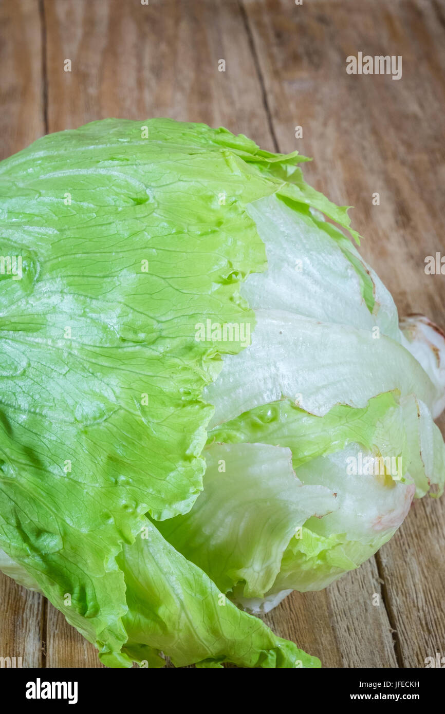 a very fresh lettuce on a wooden table old Stock Photo - Alamy