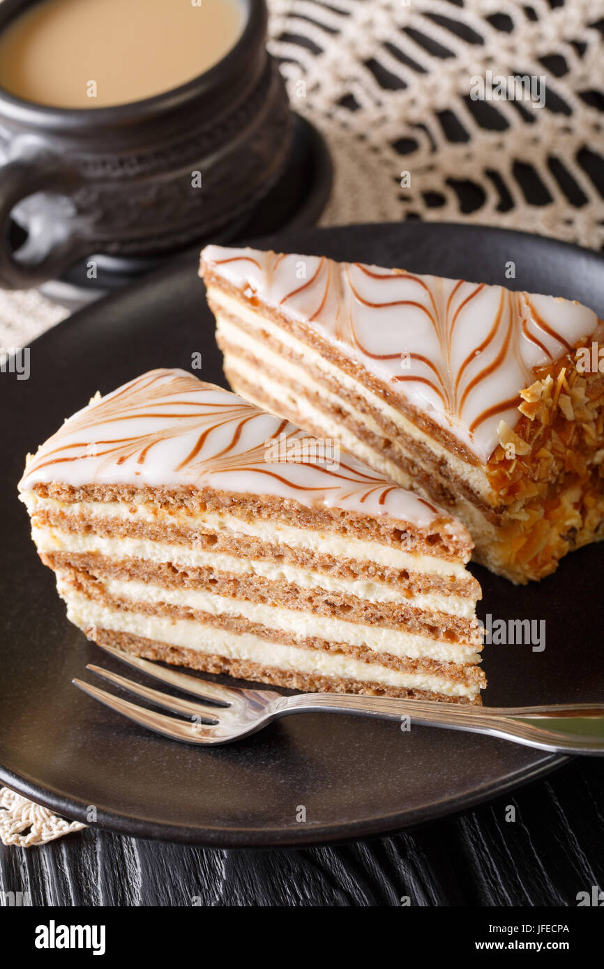 Piece of homemade esterhazy torte (cake) on a plate and coffee close-up ...